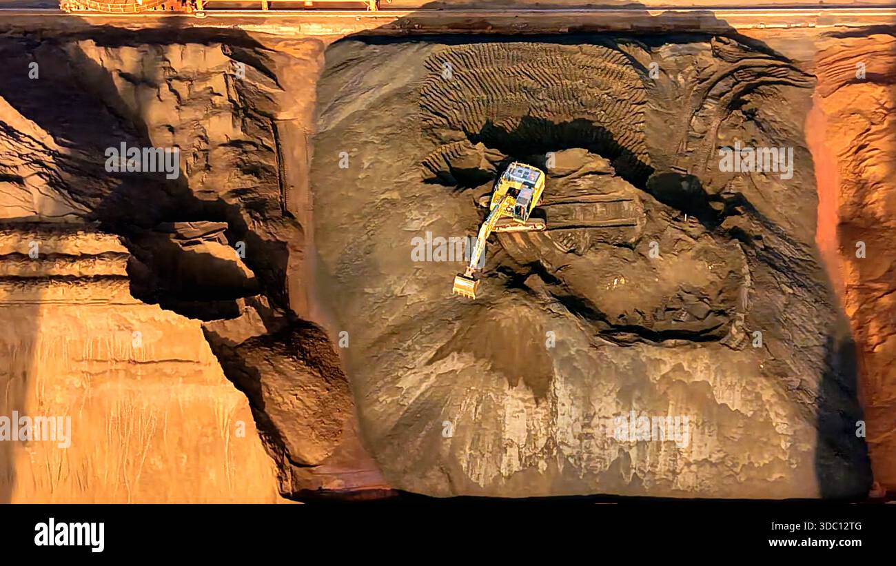 QINGDAO, CHINA - DECEMBER 19, 2025 - Construction machinery is sorting ...