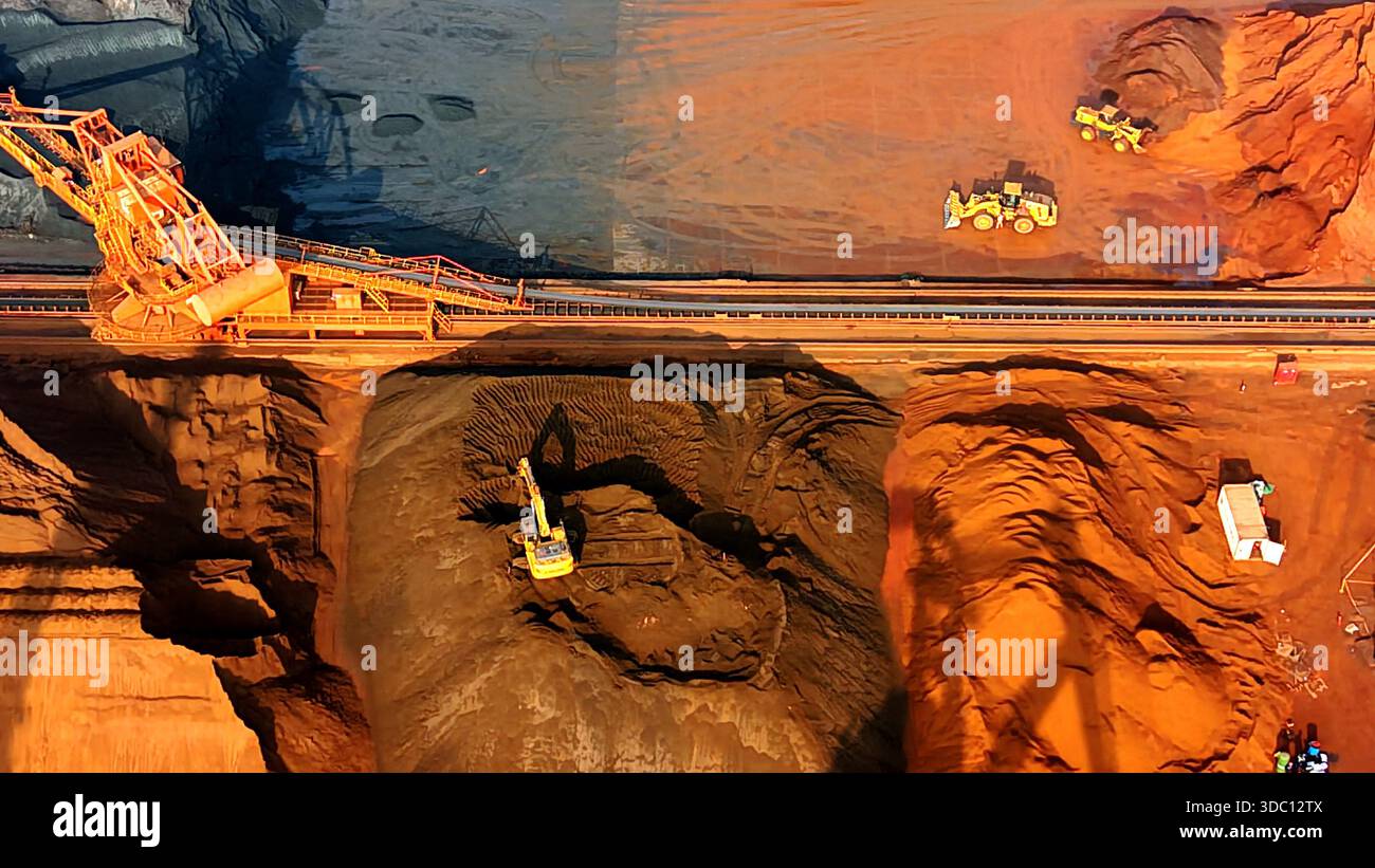 QINGDAO, CHINA - DECEMBER 19, 2025 - Construction machinery is sorting ...
