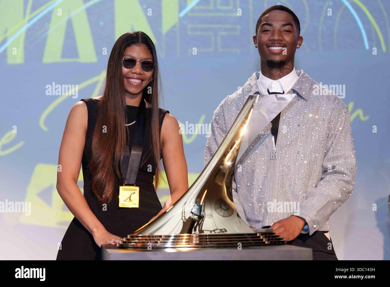 Jordan Anthony of Arkansas (right) poses with the Bowerman Award trophy ...