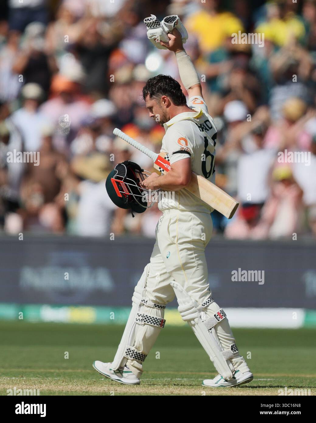 Australia's Travis Head reacts after scoring century during play on day ...