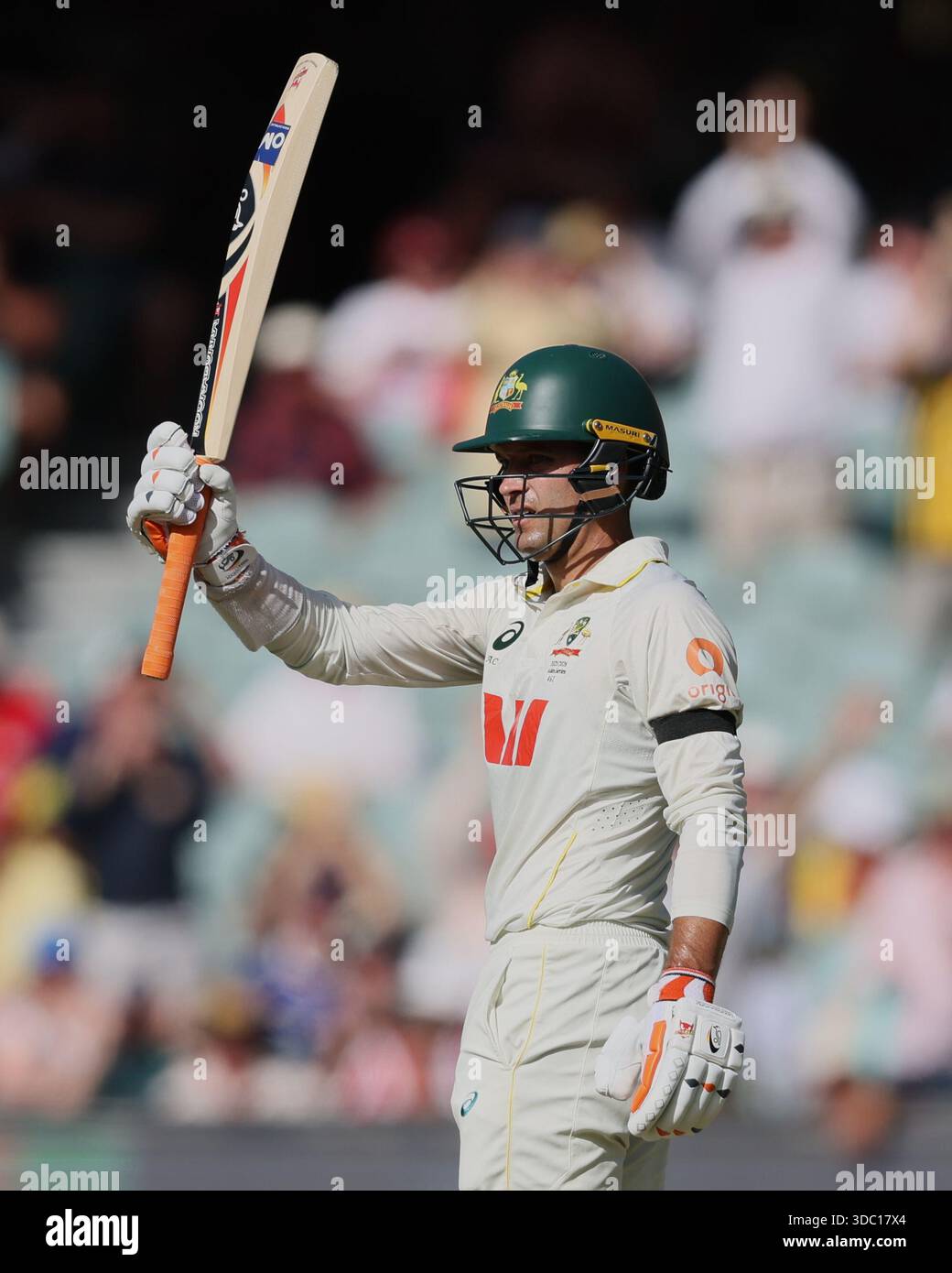 Australia's Alex Carey reacts after scoring 50 runs during play on day ...