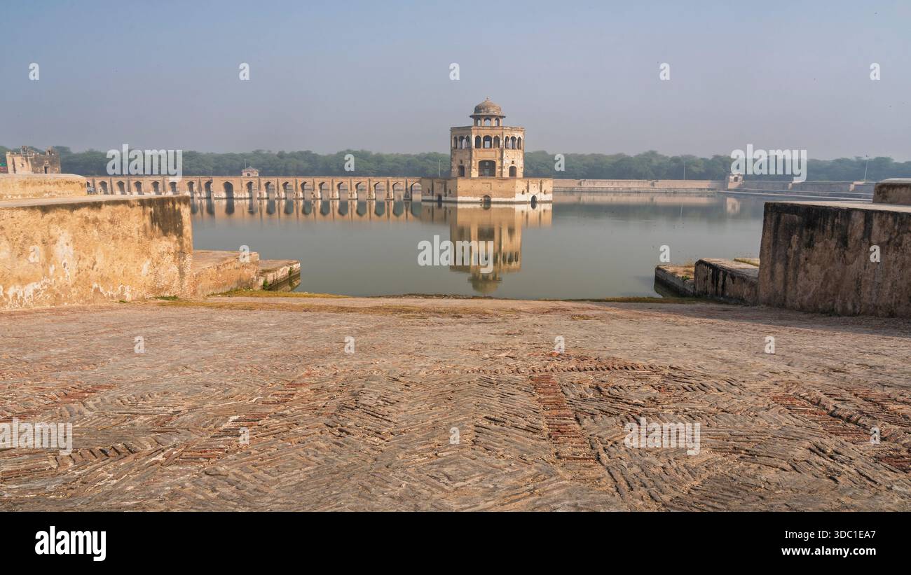 Scenic landscape view of ancient octagonal pavilion and brick causeway ...