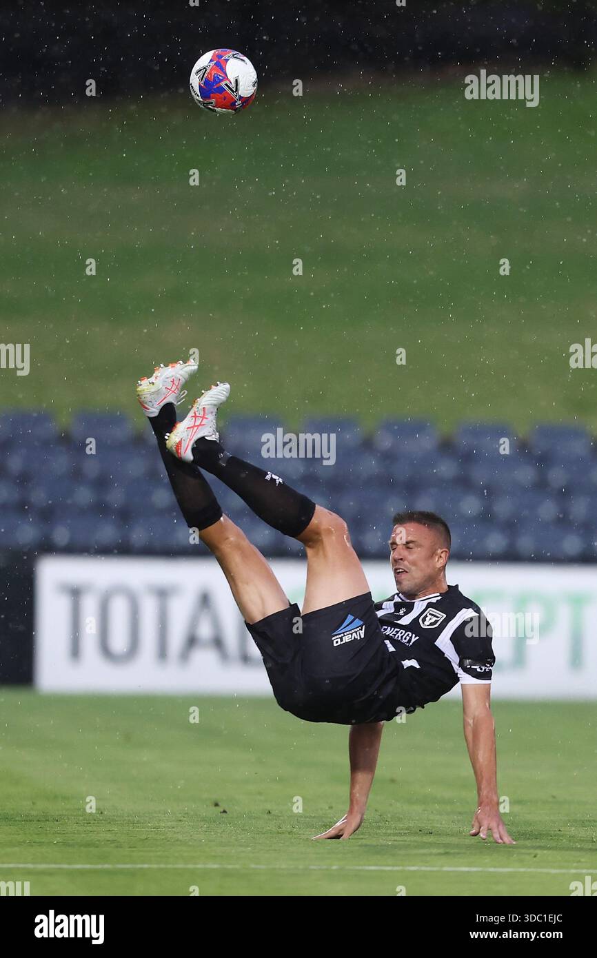 Matthew Jurman of the Bulls jumps to kick the ball during the A-League ...