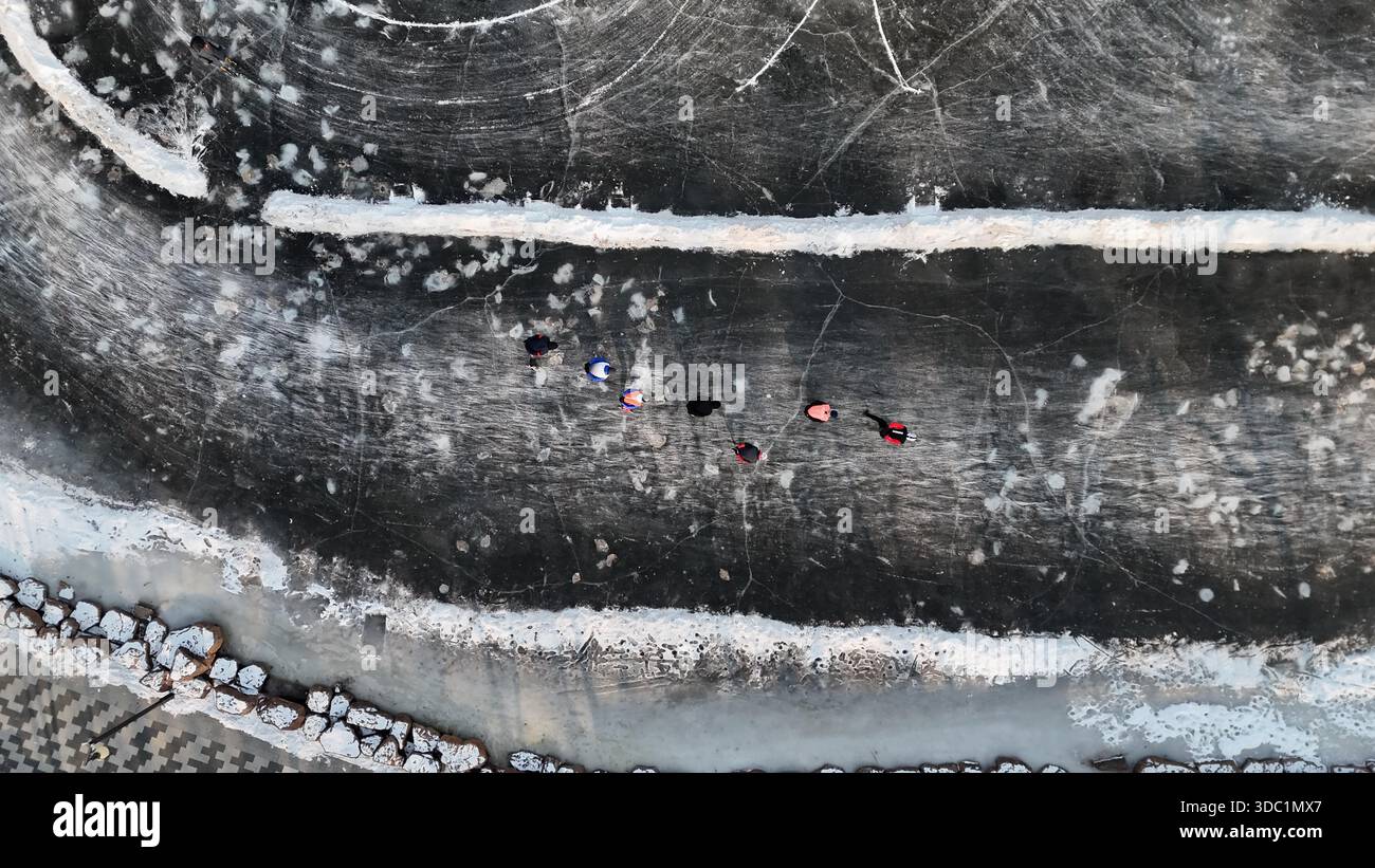 Aerial photo shows people skating on ice at a park in Shenyang City ...