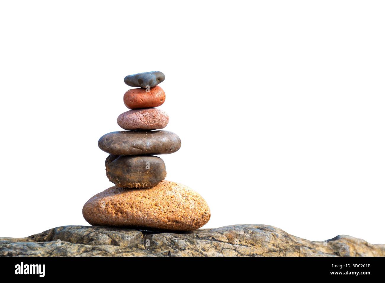 Pile of pebbles on a beach isolated on white background, balanced ...