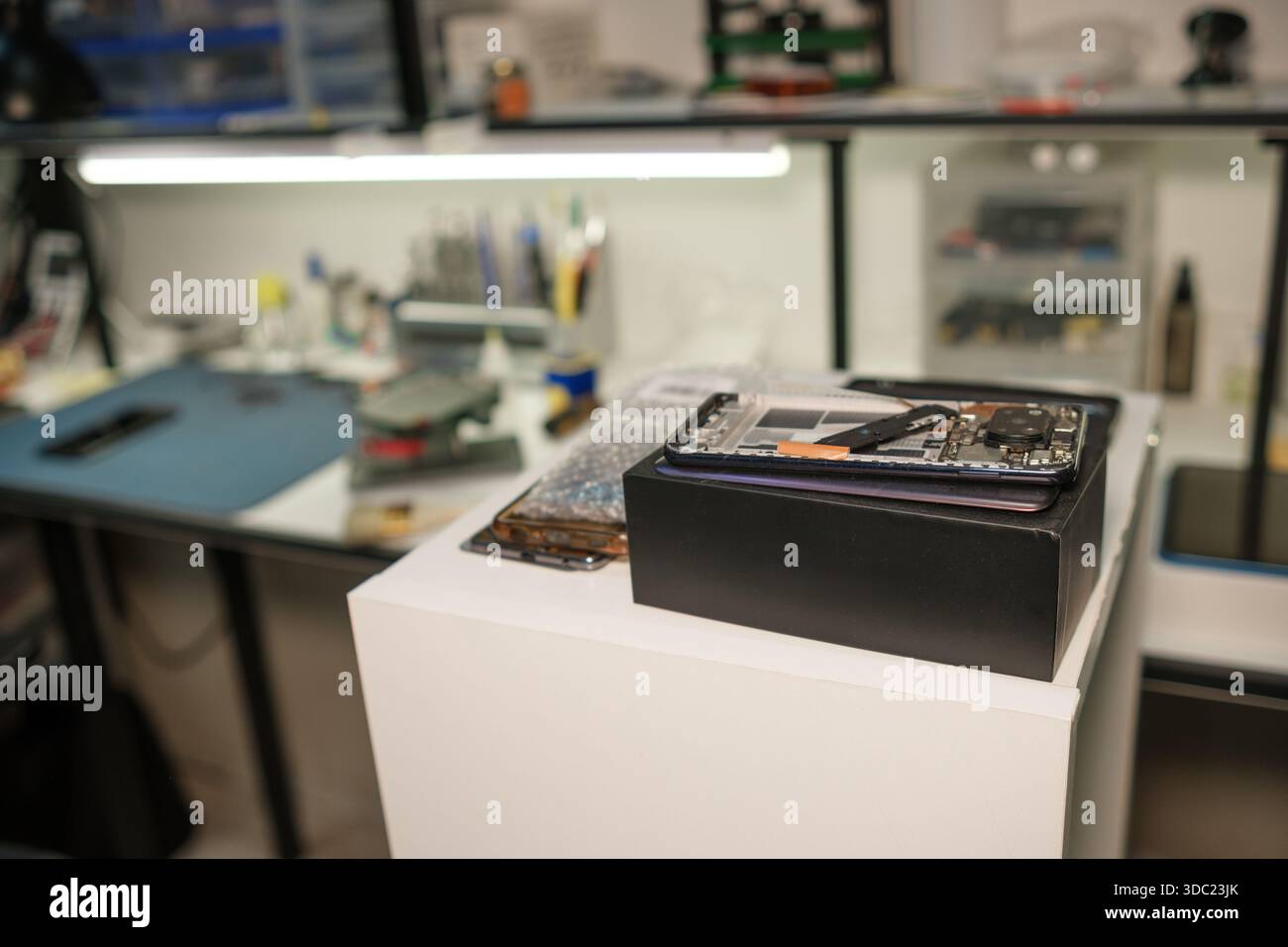 Device Repair Workstation Setup With Tools and Parts Organized on ...