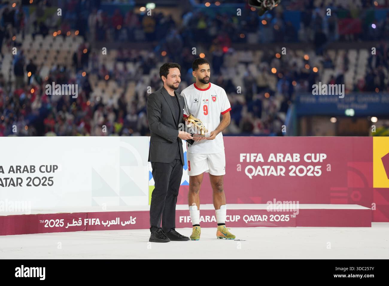 Lusail, Qatar – 18 December 2025: Ali Olwan of Jordan receives the ...