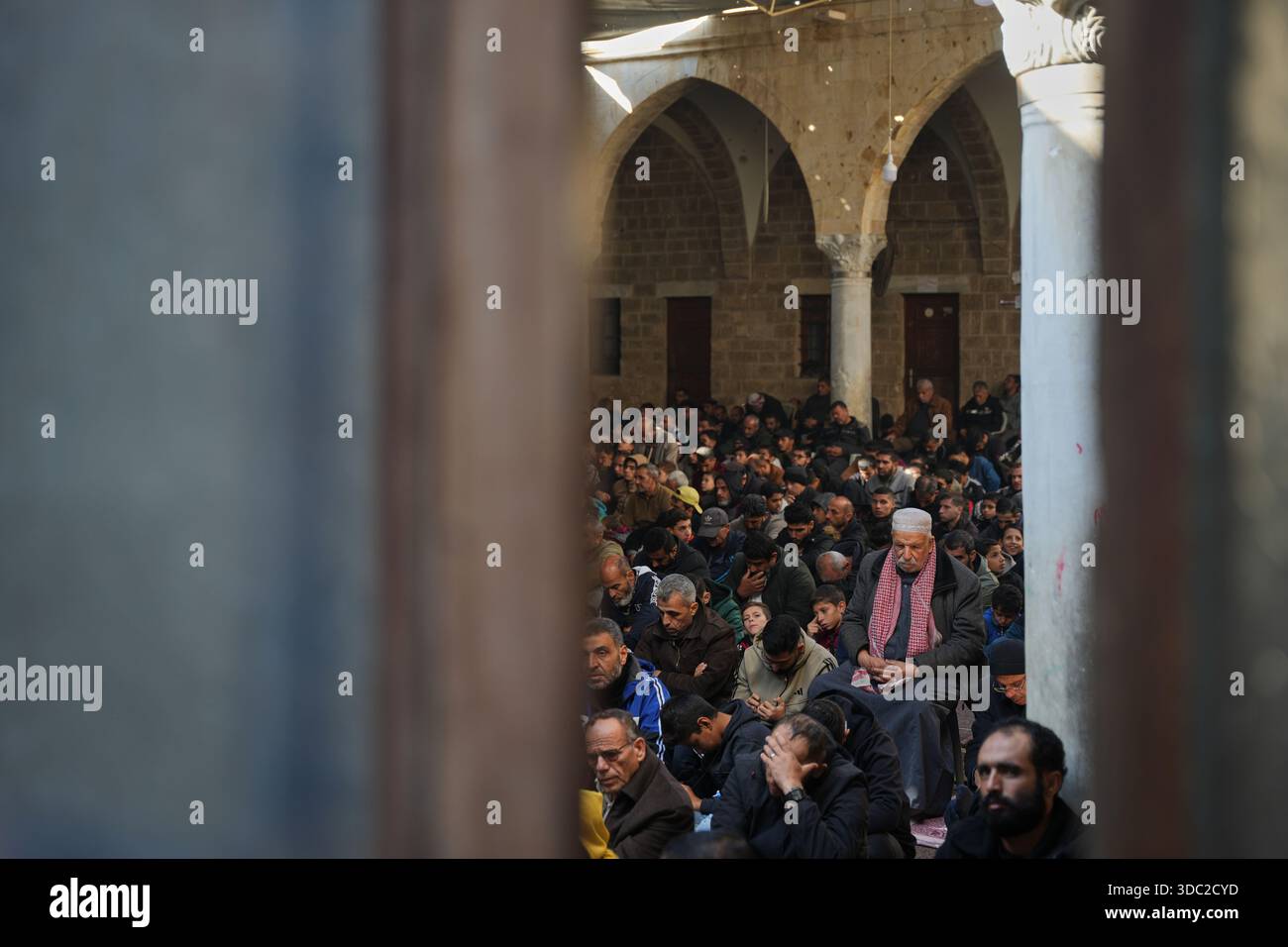 Palestinians attend Friday prayers at the Sayyid Hashim Mosque, in Gaza ...