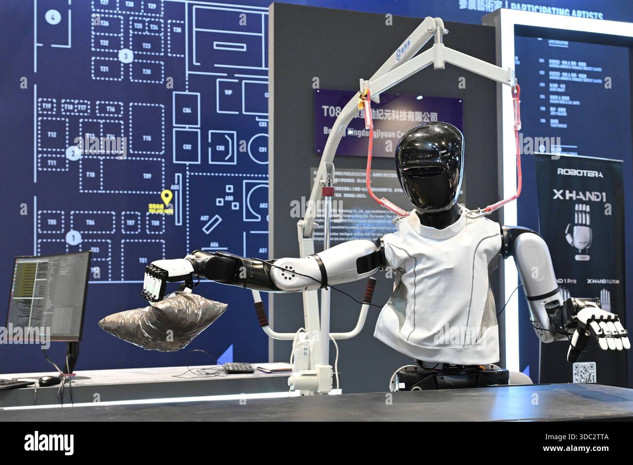 A robot distribute express packages at the Hong Kong AI Art Festival on ...