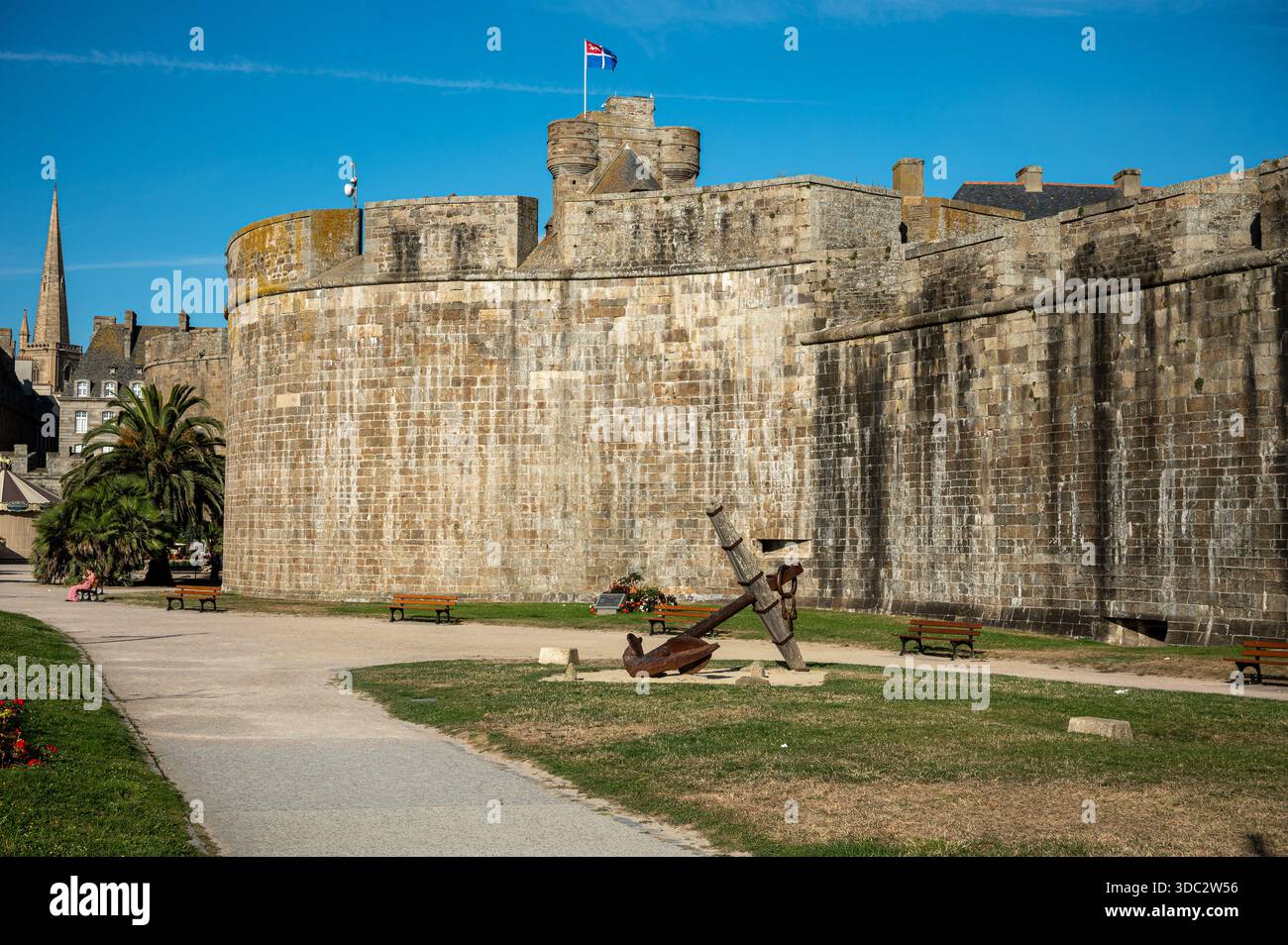 Medieval stone city walls and a round defensive tower of Saint-Malo ...