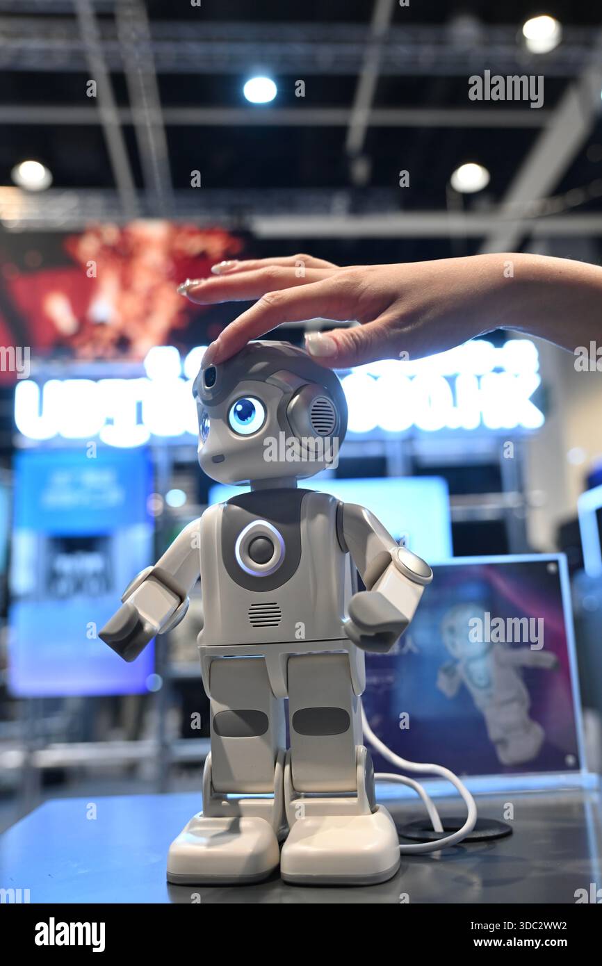 The visitor touching the robot at the Hong Kong AI Art Festival on ...