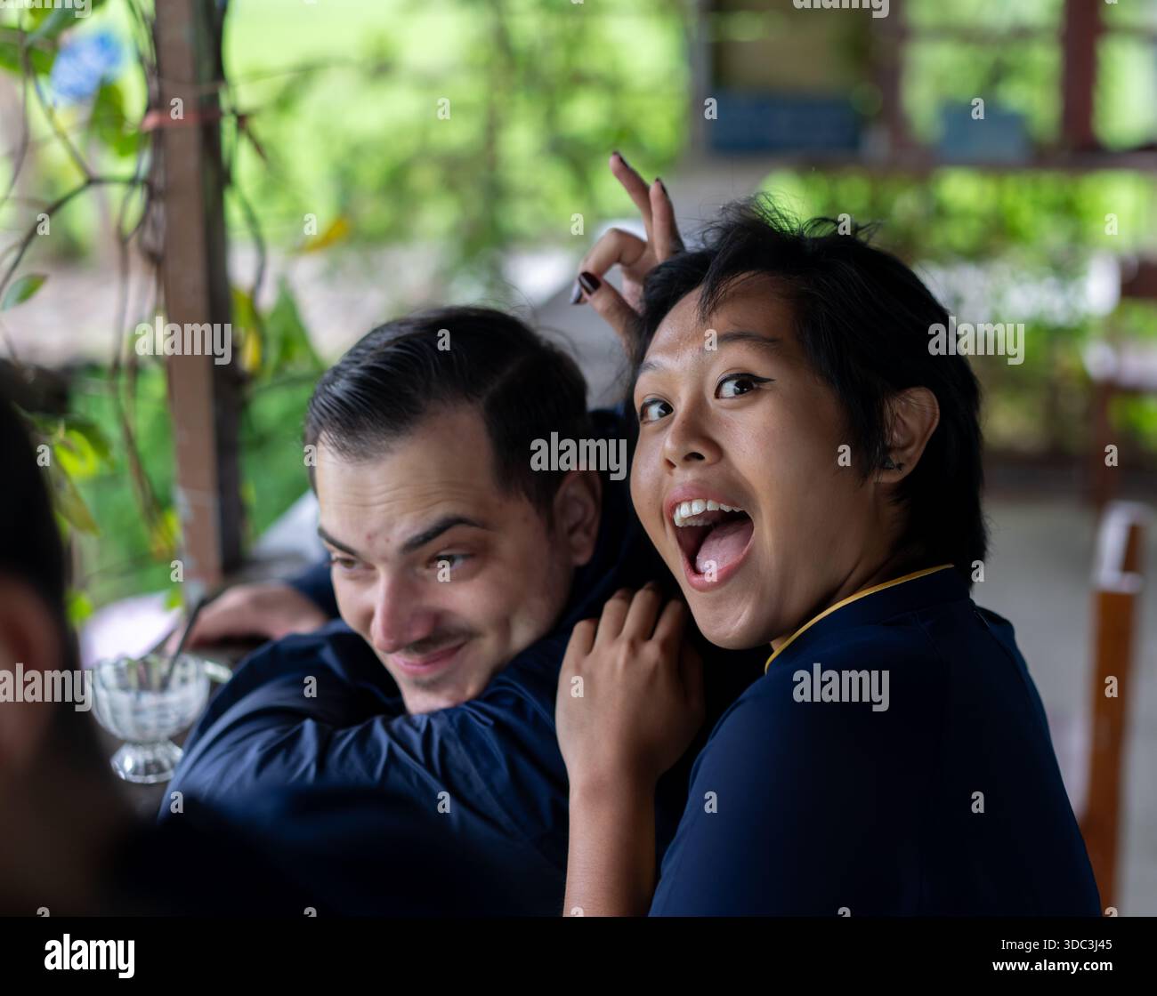 Couple cuddling cafe high hi-res stock photography and images - Alamy