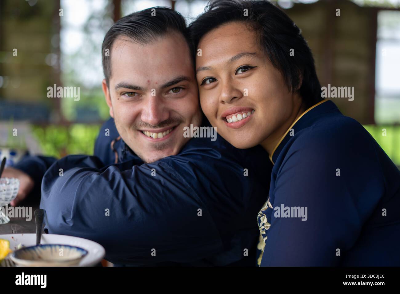 Couple cuddling cafe high hi-res stock photography and images - Alamy