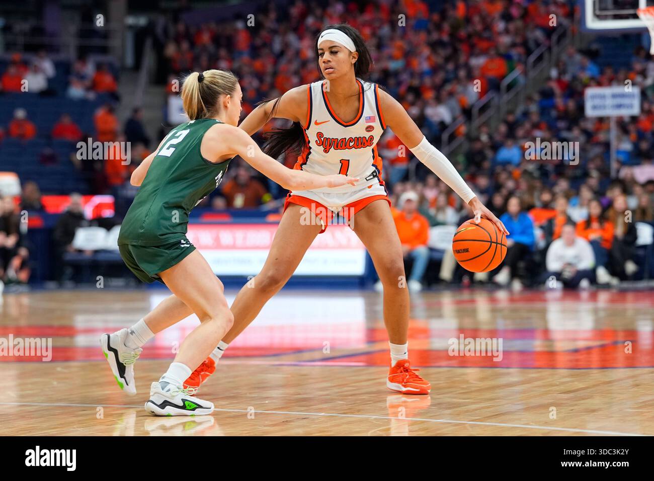 SYRACUSE, NY - DECEMBER 19: Syracuse Orange Forward Keira Scott (1) dribbles the ball against ...