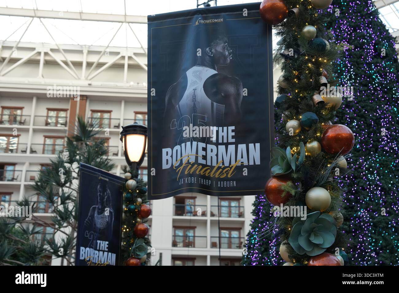 A banner featuring Bowerman Award finalist Ja'Kobe Tharp of Auburn at ...