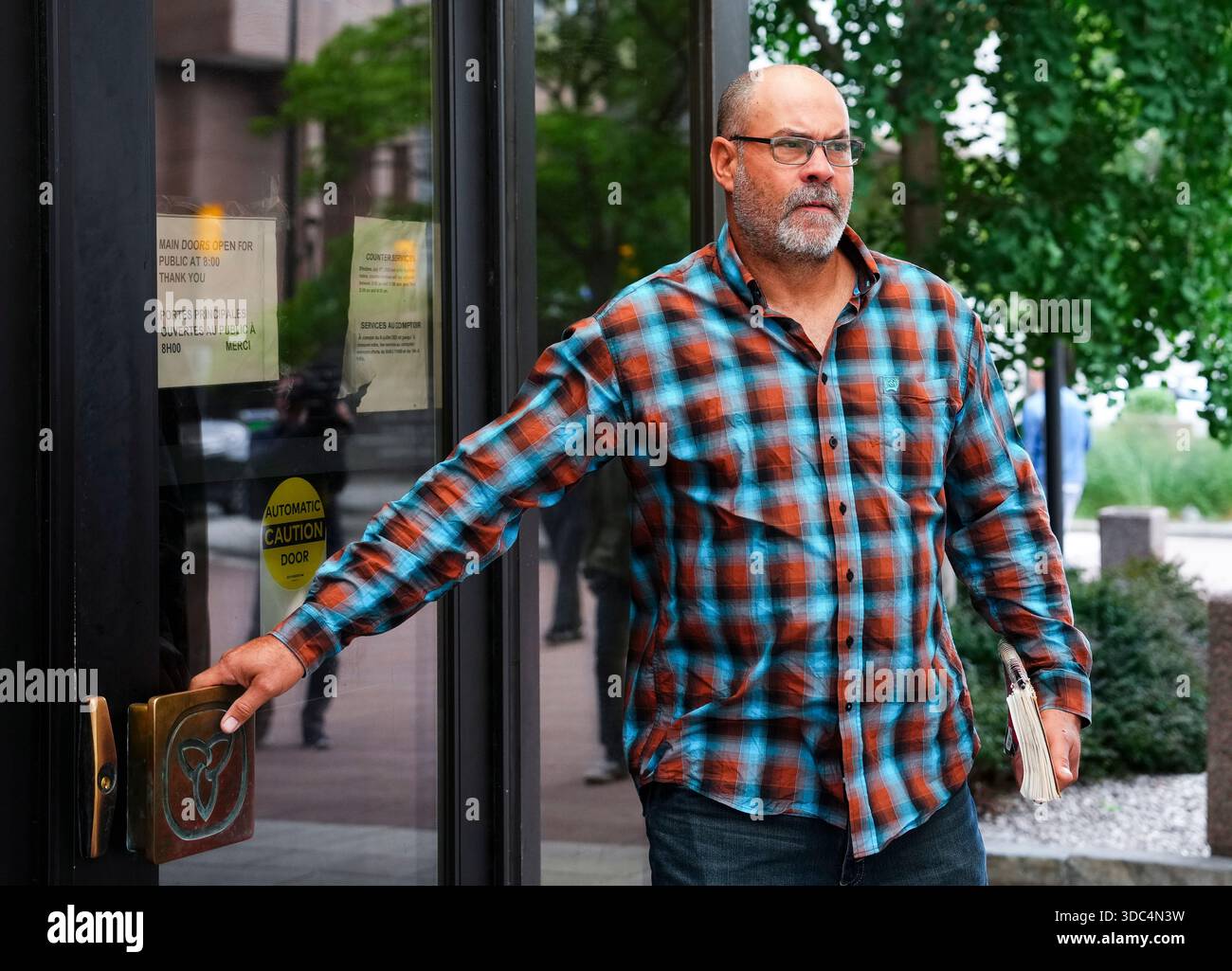 Chris Barber arrives at the courthouse in Ottawa on Tuesday, Aug. 20 ...