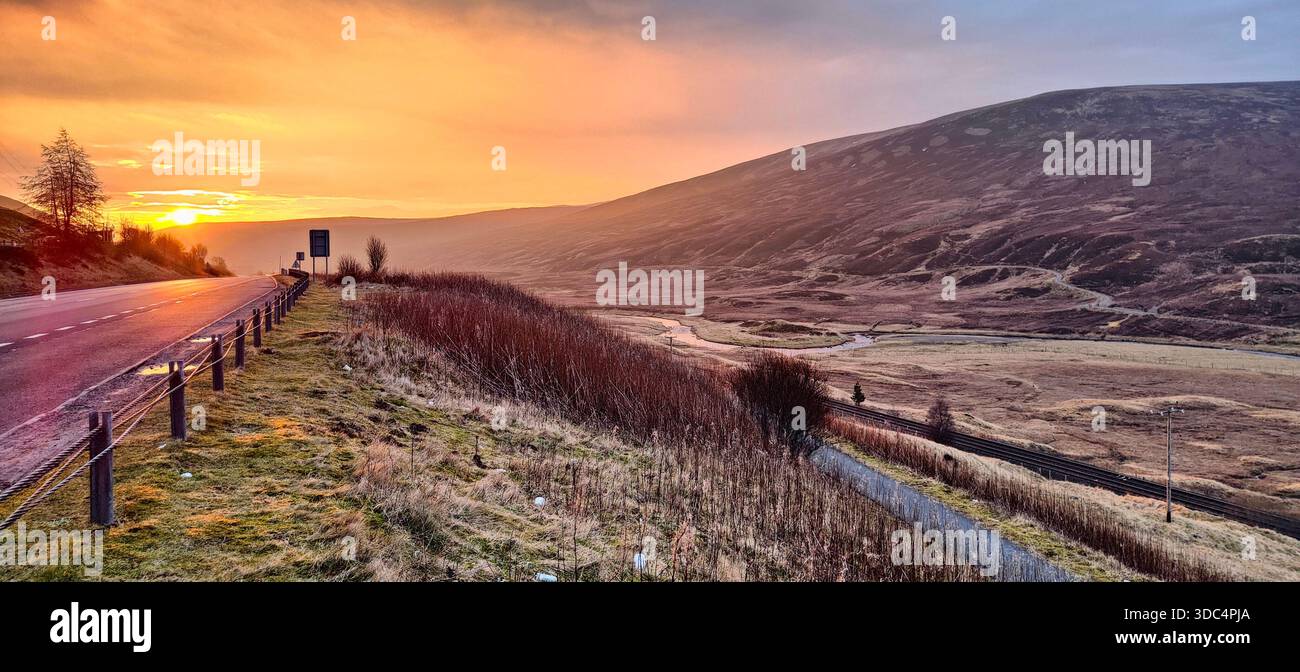 A breathtaking, colourful sunrise lights on the Scottish Highlands near ...