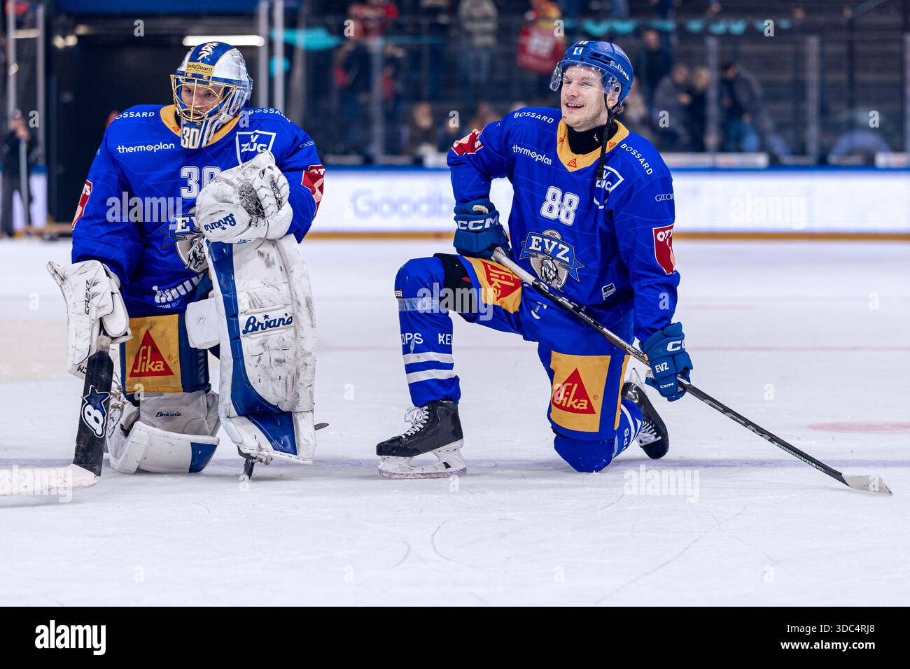 Goaltenders Leonardo Genoni #30 (EV Zug) and Sven Senteler #88 (EV Zug ...
