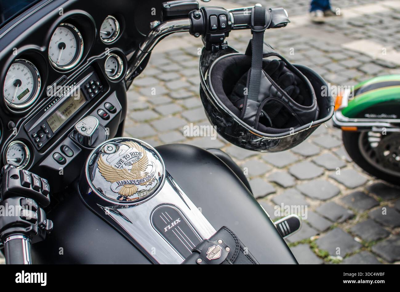 Harley-Davidson cockpit with helmet hanging on handlebars during ...