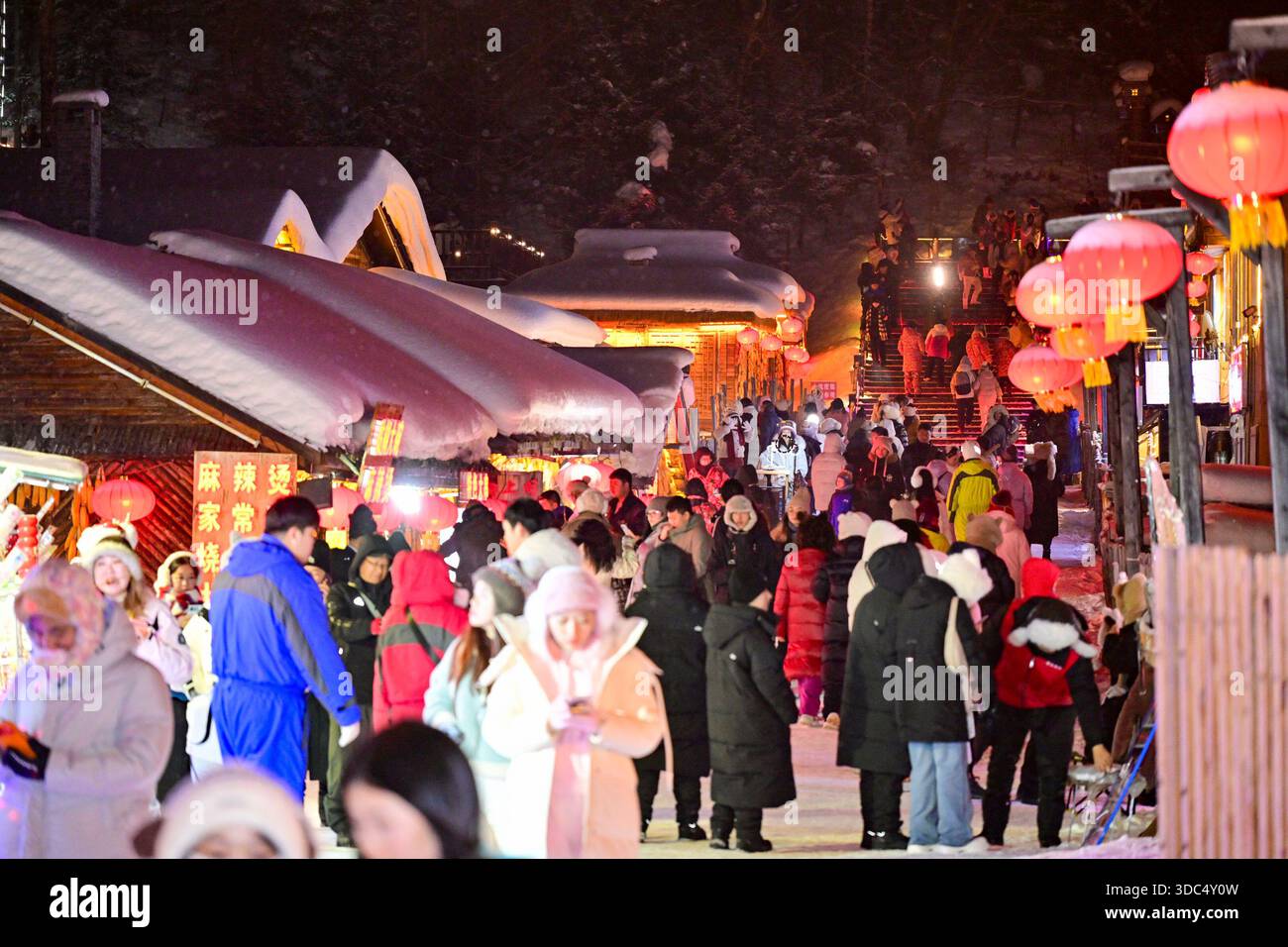 HAILIN, CHINA - DECEMBER 19, 2025 - Tourists experience ice and snow ...