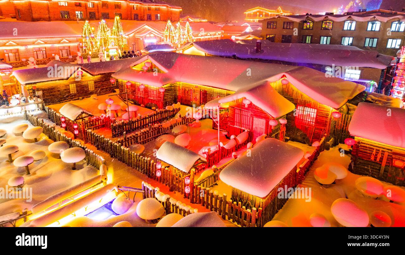 HAILIN, CHINA - DECEMBER 19, 2025 - Tourists experience ice and snow ...