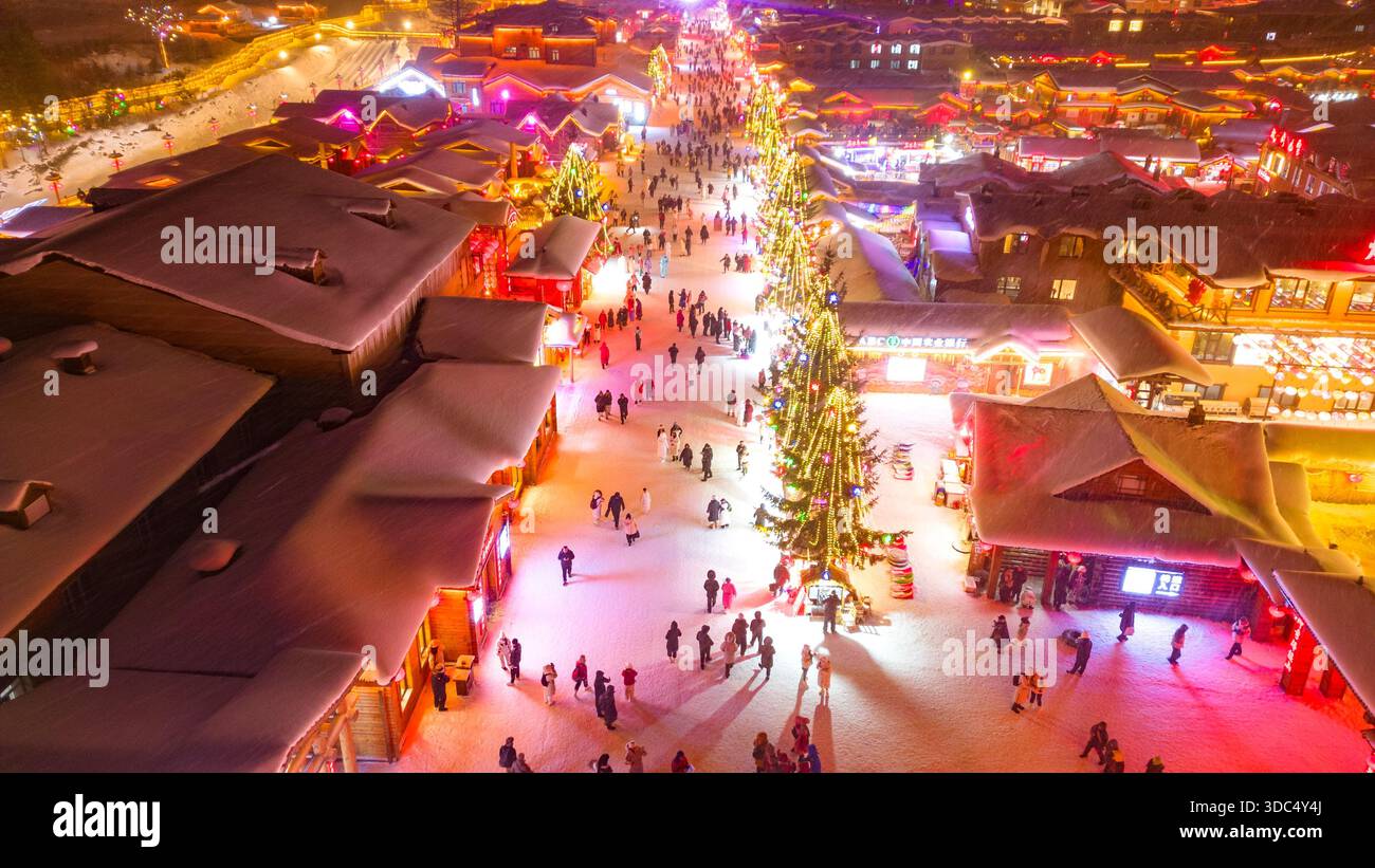 HAILIN, CHINA - DECEMBER 19, 2025 - Tourists experience ice and snow ...