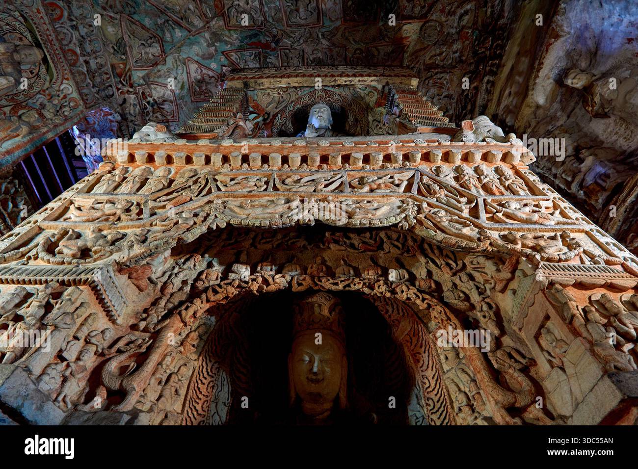 Ornate interior rock carving inside the ancient Yungang Grottoes ...