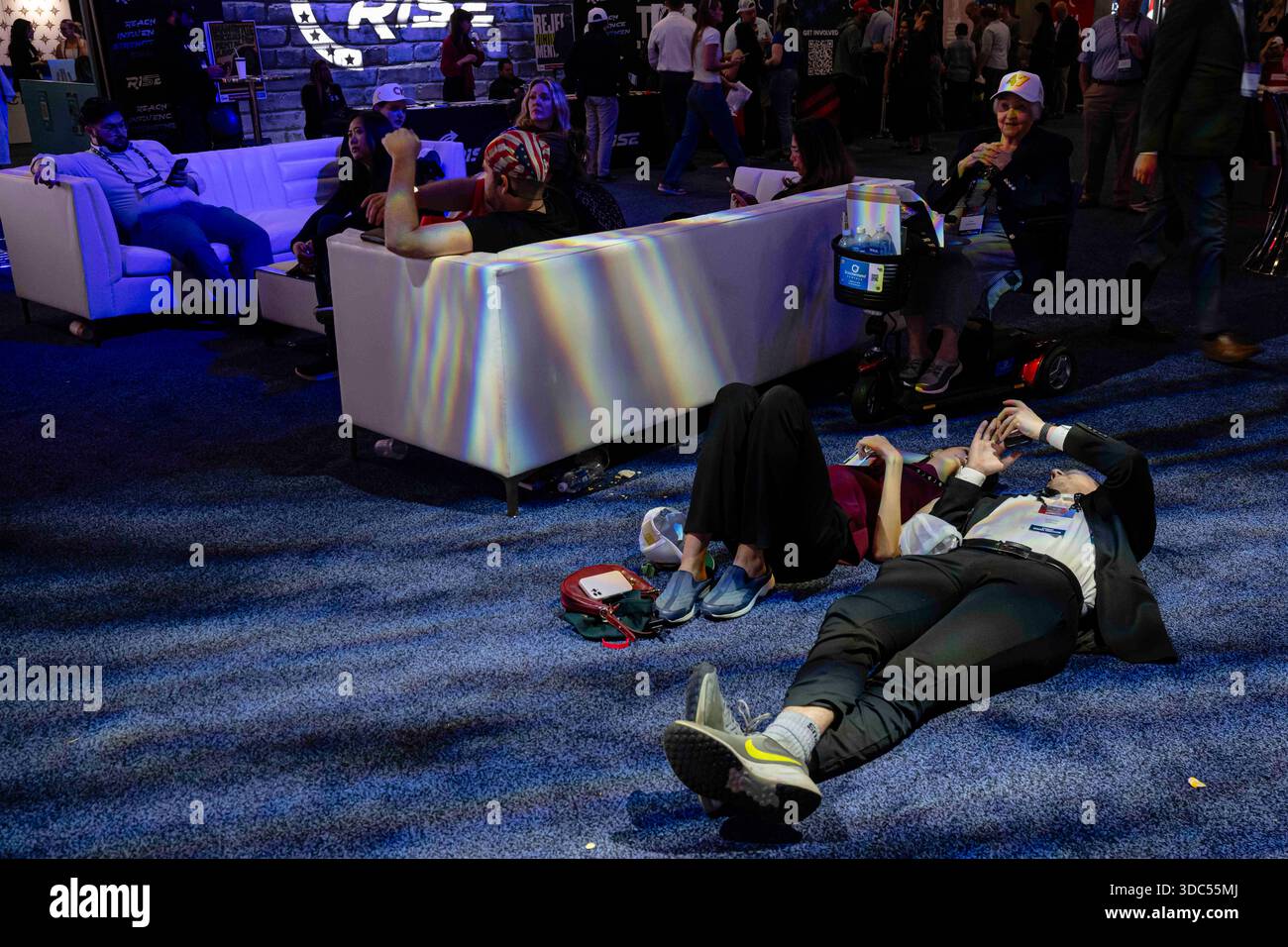 Attendees rest in a lounge area during Turning Point USA's AmericaFest ...