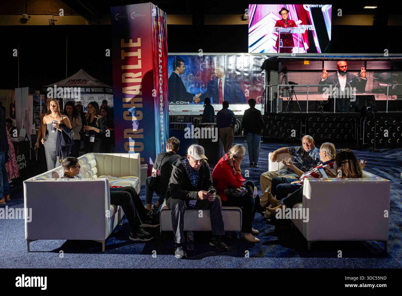 Attendees rest in a lounge area during Turning Point USA's AmericaFest ...