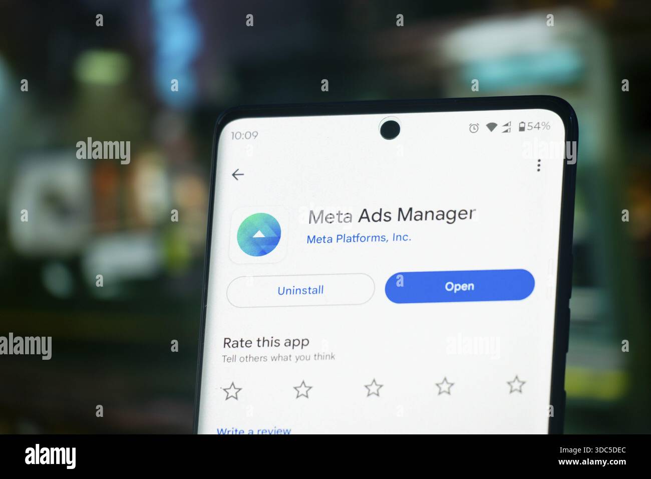 Smartphone displaying Meta Ads Manager app on Google Play Store with a ...