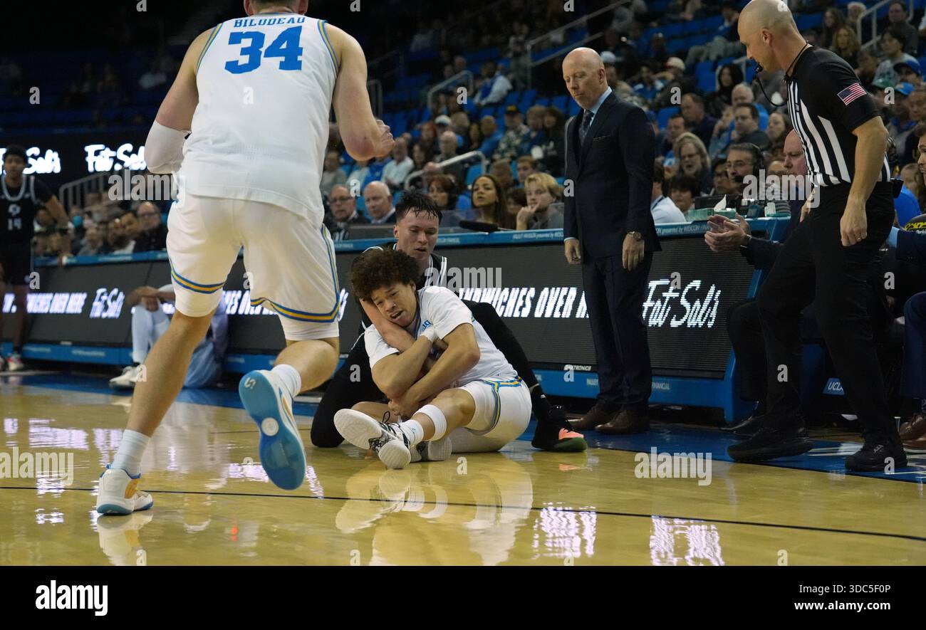 UCLA head coach Mick Cronin looks down as UCLA guard Trent Perry (0 ...
