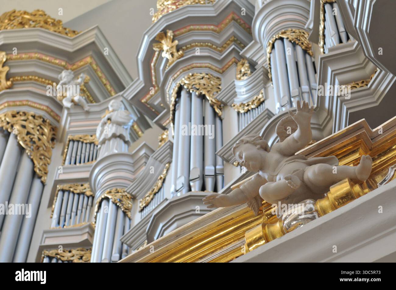 Baroque pipe organ with angel sculpture inside the Jesuit Basilica in ...