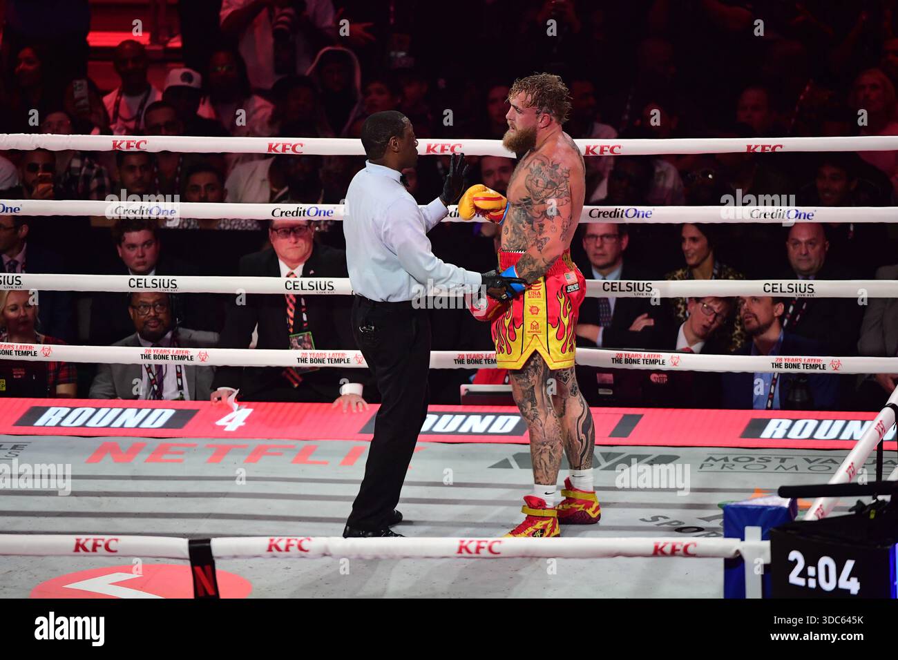 The referee talks with Jake Paul in the fourth round during his boxing ...
