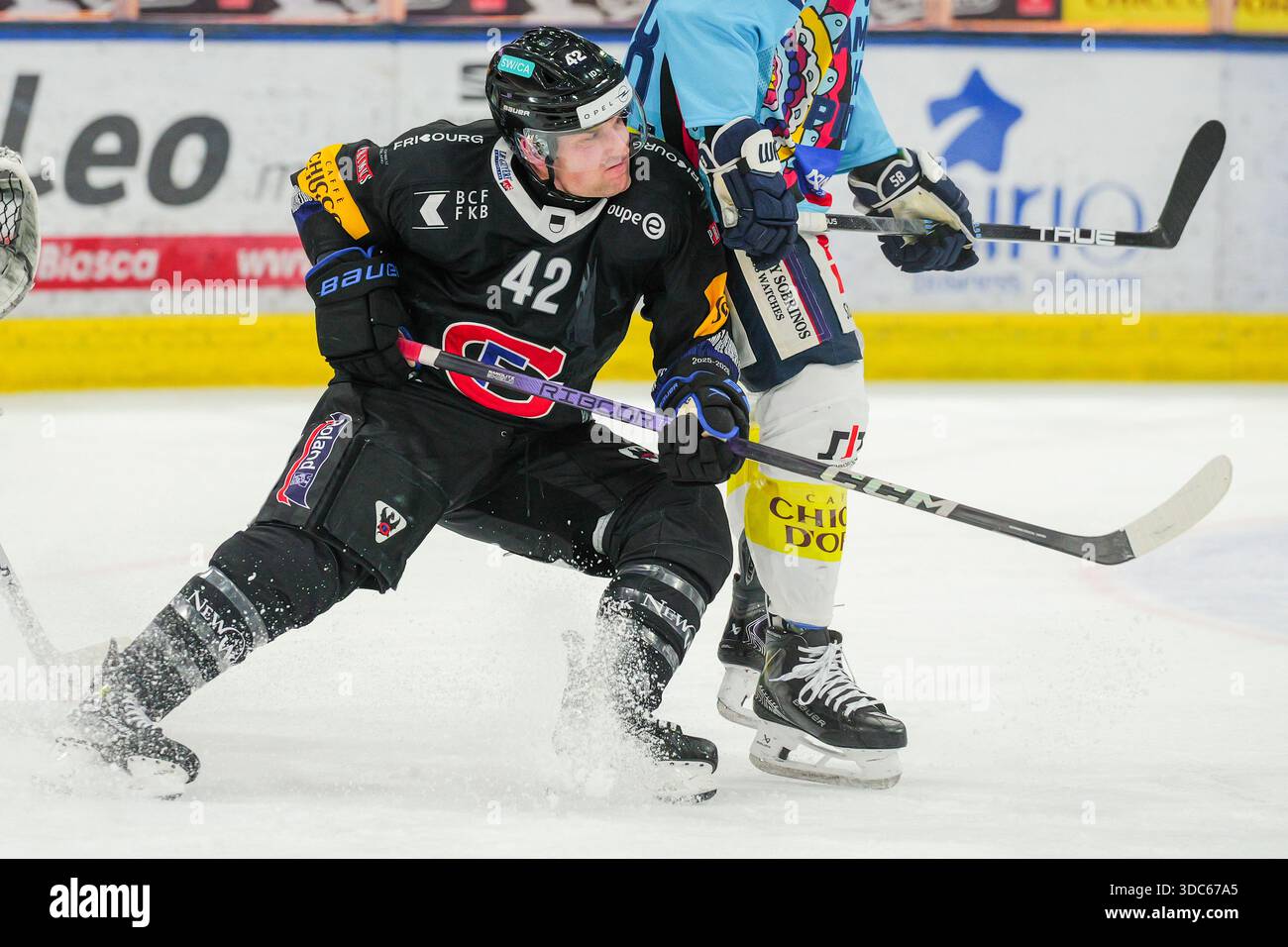 AMBRI, SWITZERLAND - DECEMBER 19: Kyle Rau of Fribourg in action during ...