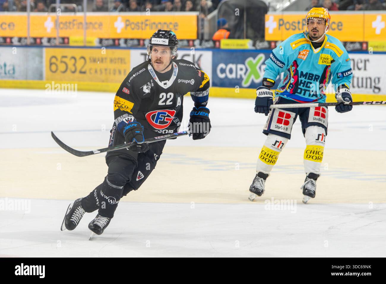 AMBRI, SWITZERLAND - DECEMBER 19: Christoph Bertschy of Fribourg L) in ...