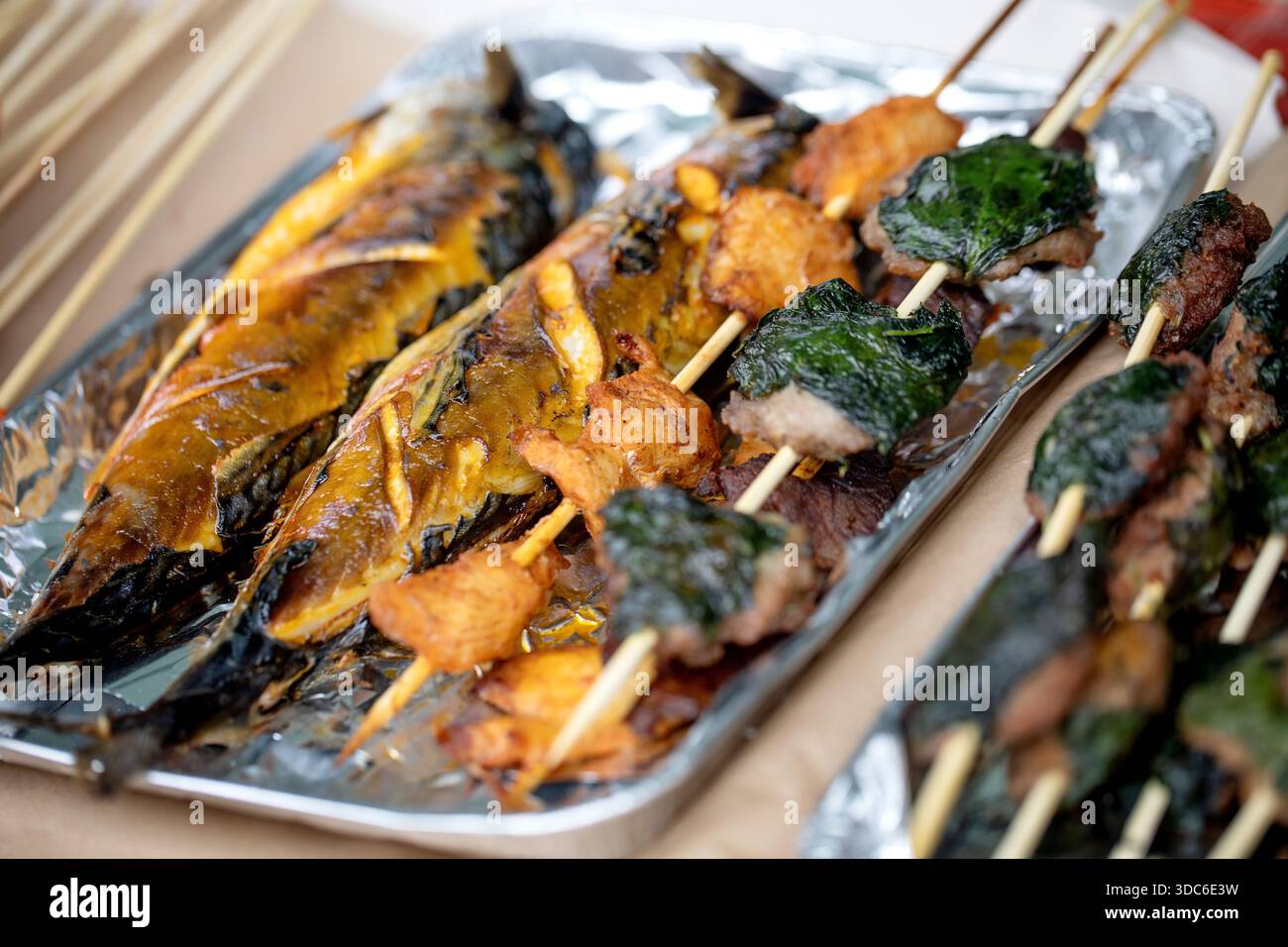 Traditional Japanese yakitori skewers with grilled fish and meat ...