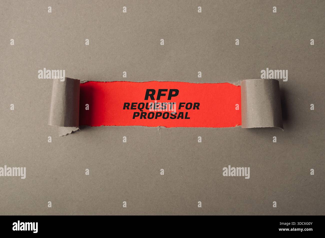 Orange paper strip displays bold black text reading RFP, request for ...