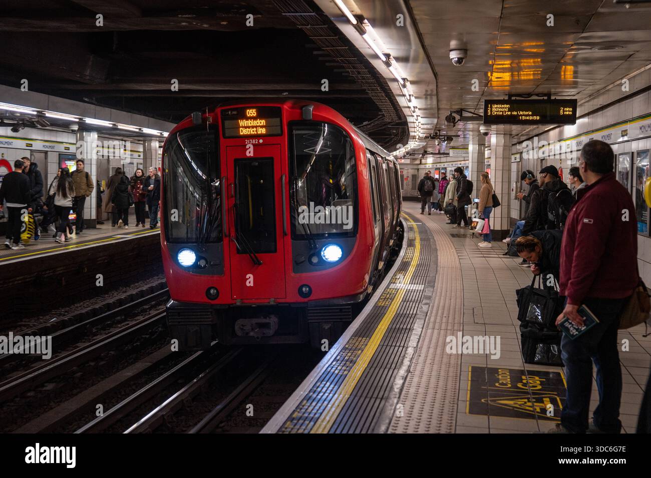 A district Line tube train arriving at a train station on December 19 ...
