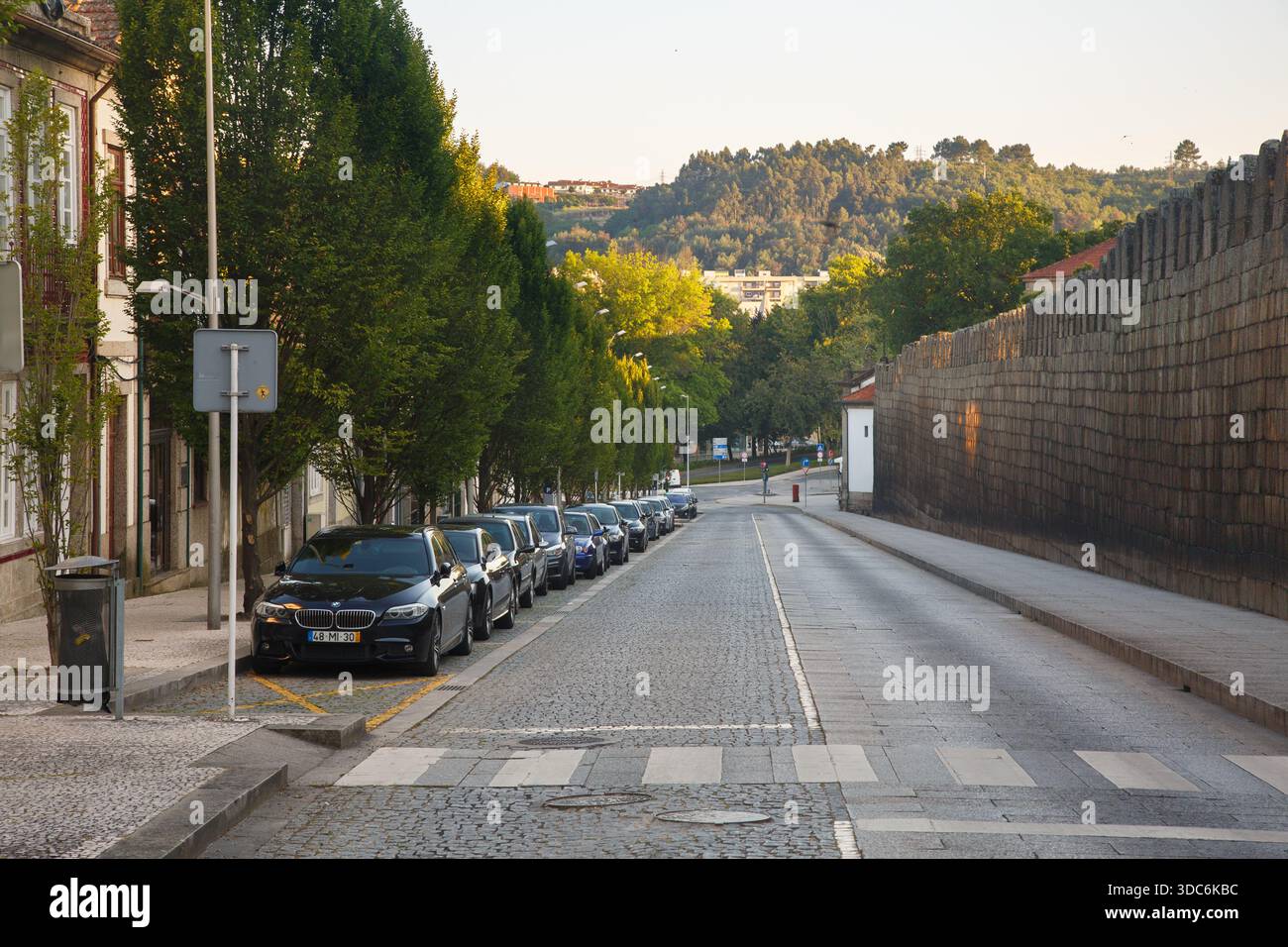The Typical historical portuguese style houses and a stone wall of ...