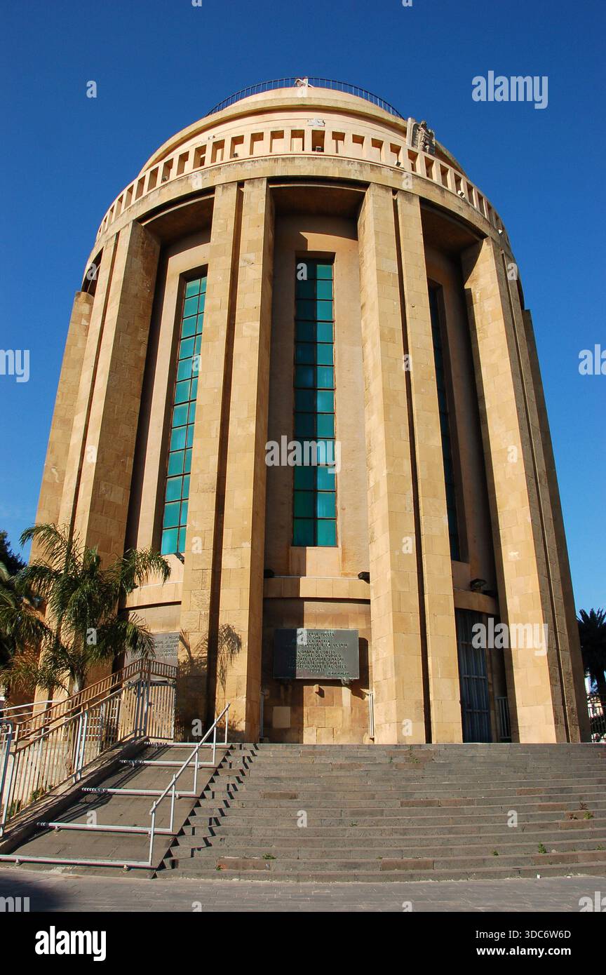 Monumental circular stone building with tall columns and turquoise ...