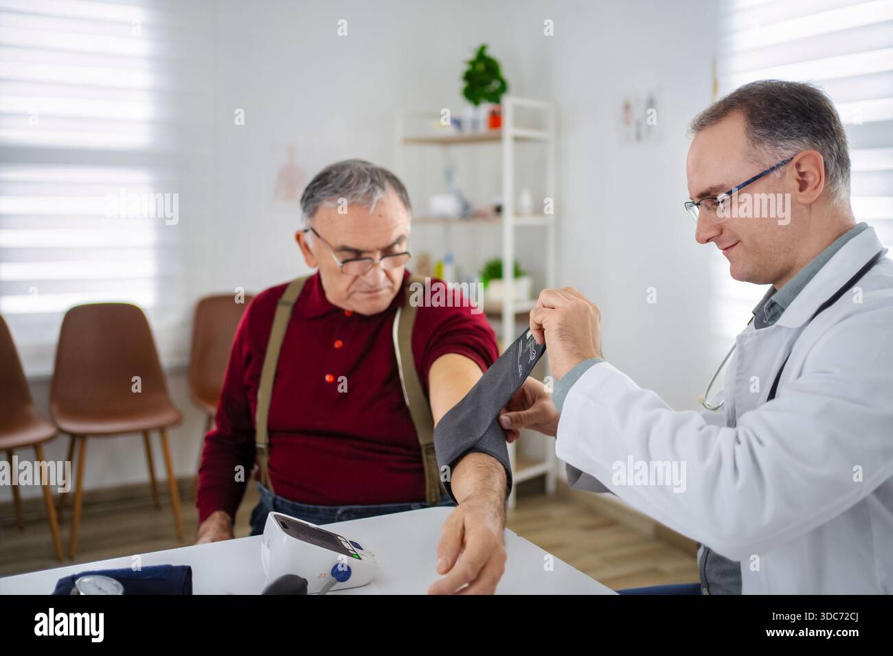 Caring doctor checks blood hi-res stock photography and images - Alamy