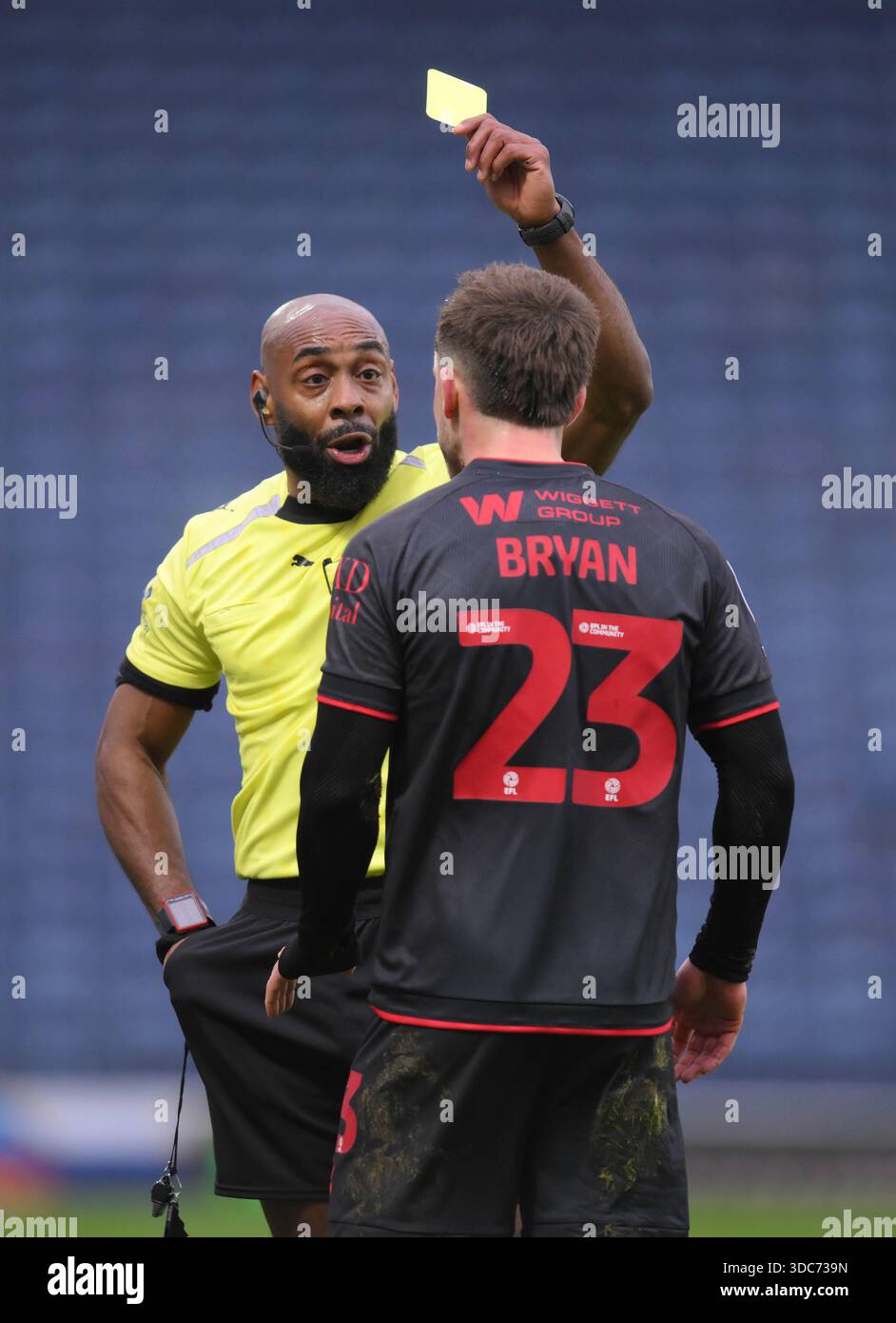 Millwall's Joe Bryan is shown a yellow card by Referee Sam Allison ...