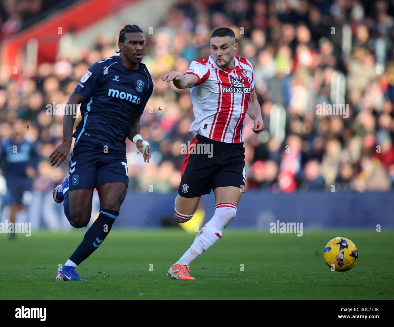 Southampton's Taylor Harwood-Bellis battles for the ball with Coventry ...