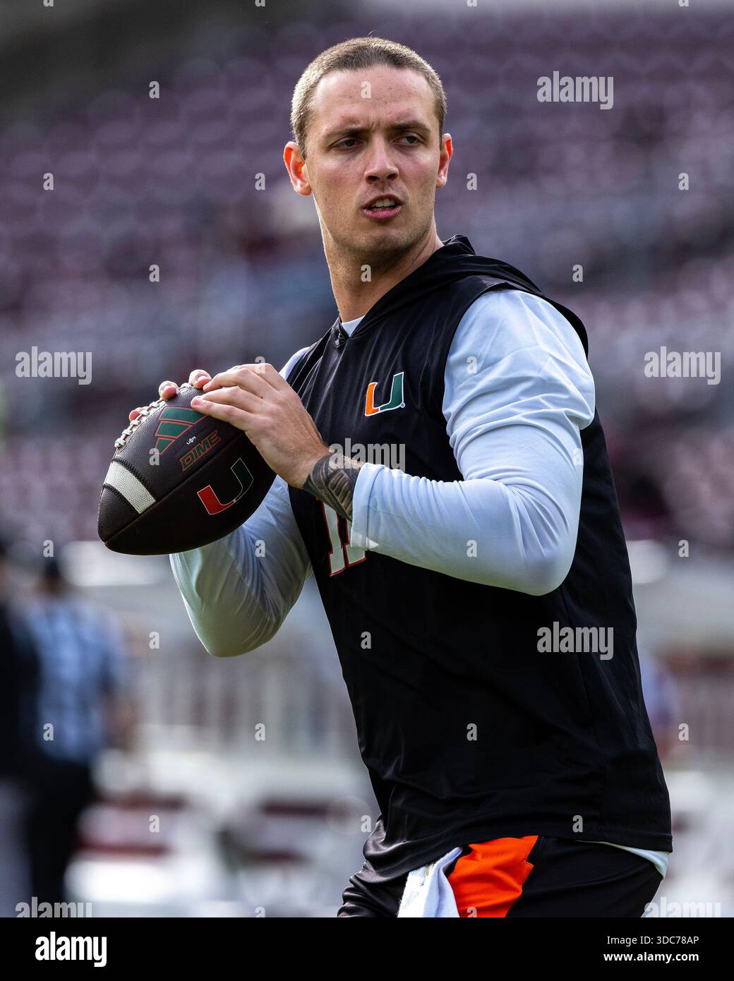 Dec 20, 2025. Carson Beck (11) of the Miami Hurricanes pre game before ...