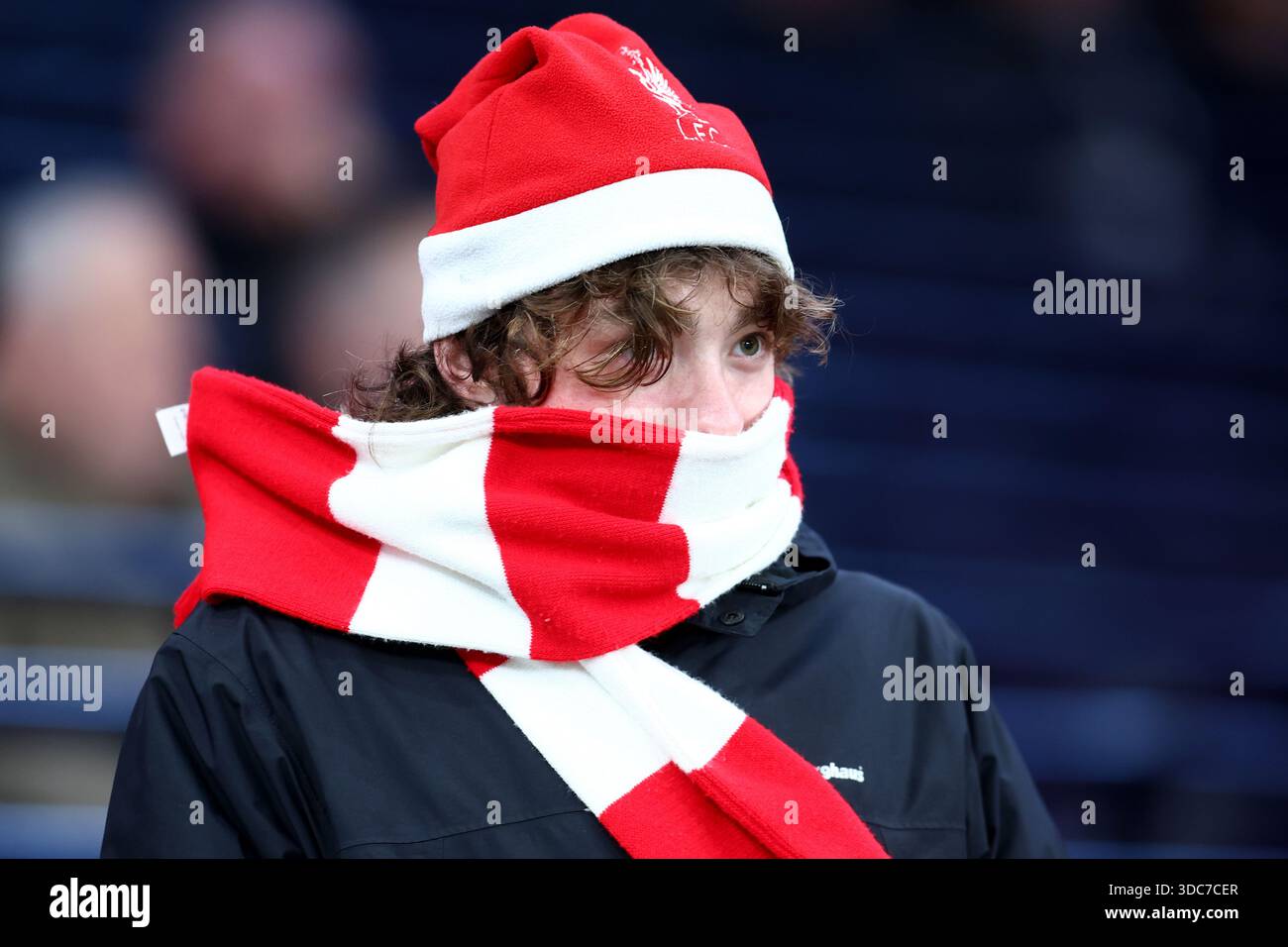 London, England, 20th December 2025. Liverpool fan with a Christmas hat ...