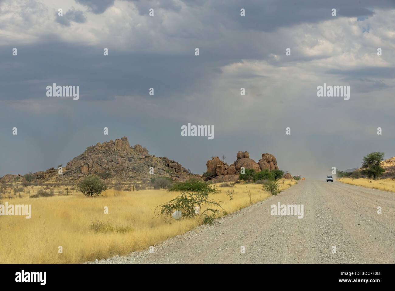 Car Driving on Gravel Road in Namibia’s Hardap Region, Raising Dust ...