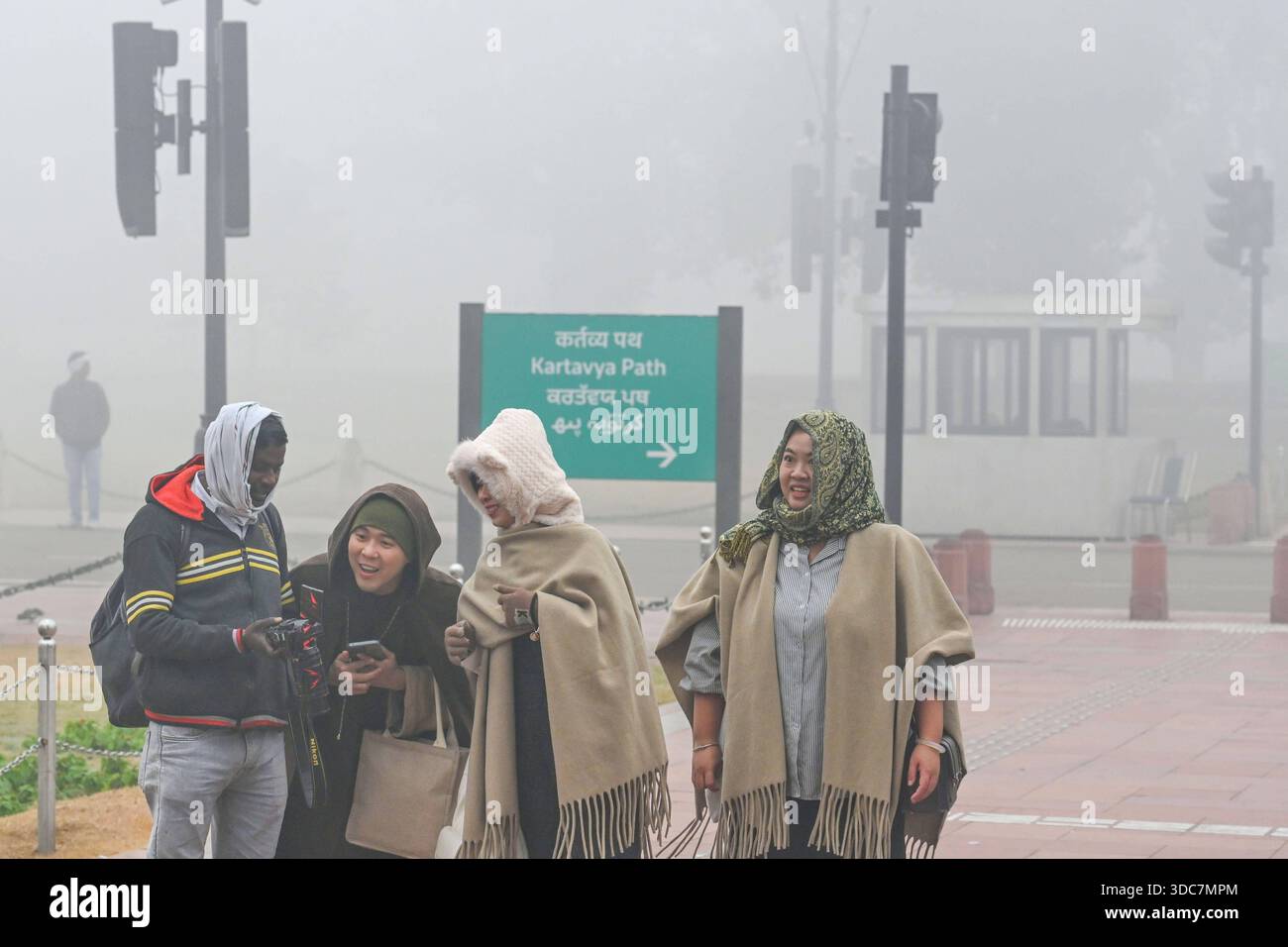 NEW DELHI, INDIA - DECEMBER 20: People seen out on a cold and Foggy ...
