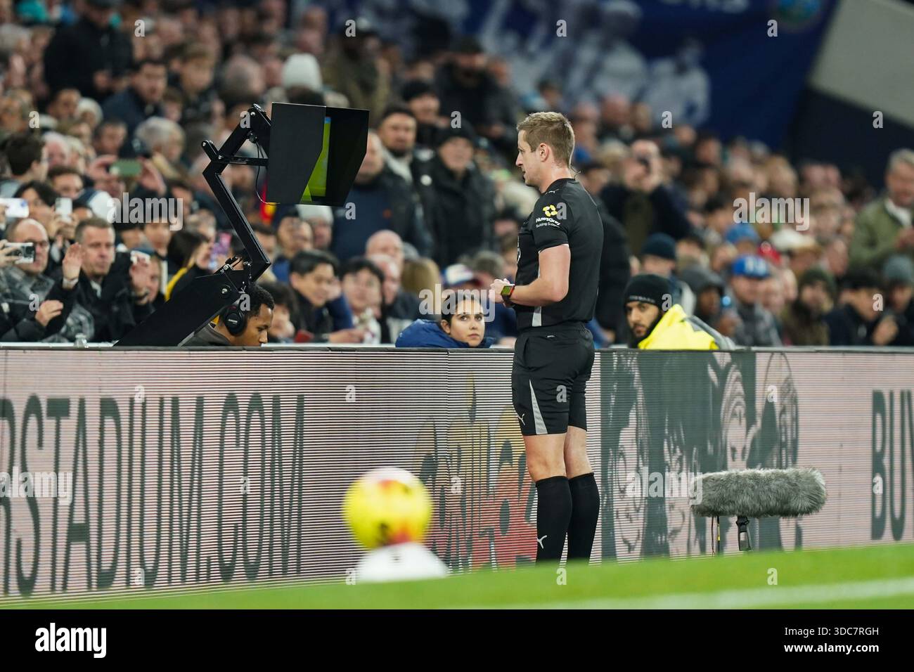 Referee John Brooks checking the VAR screen after Xavi Simons of ...