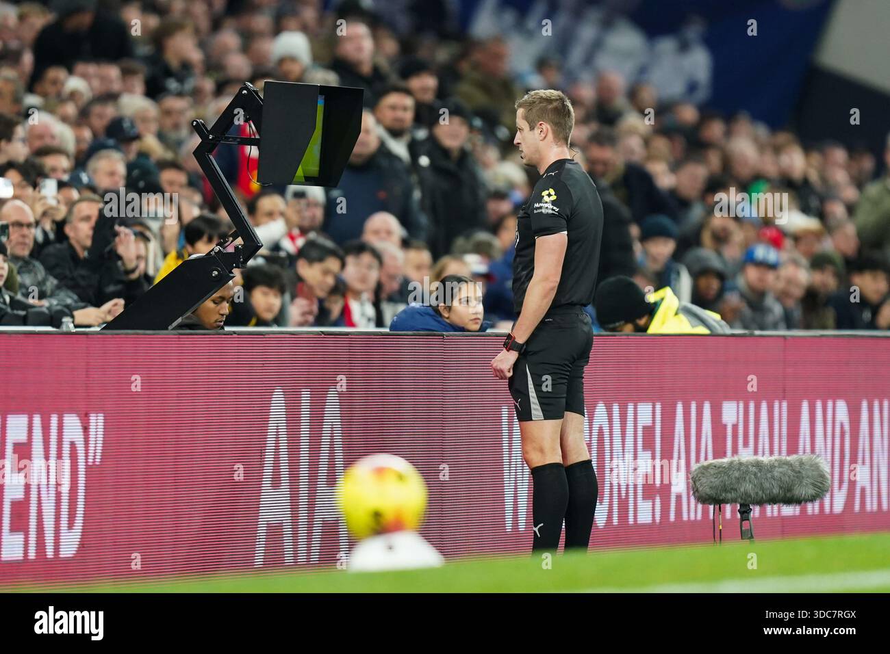 Referee John Brooks checking the VAR screen after Xavi Simons of ...