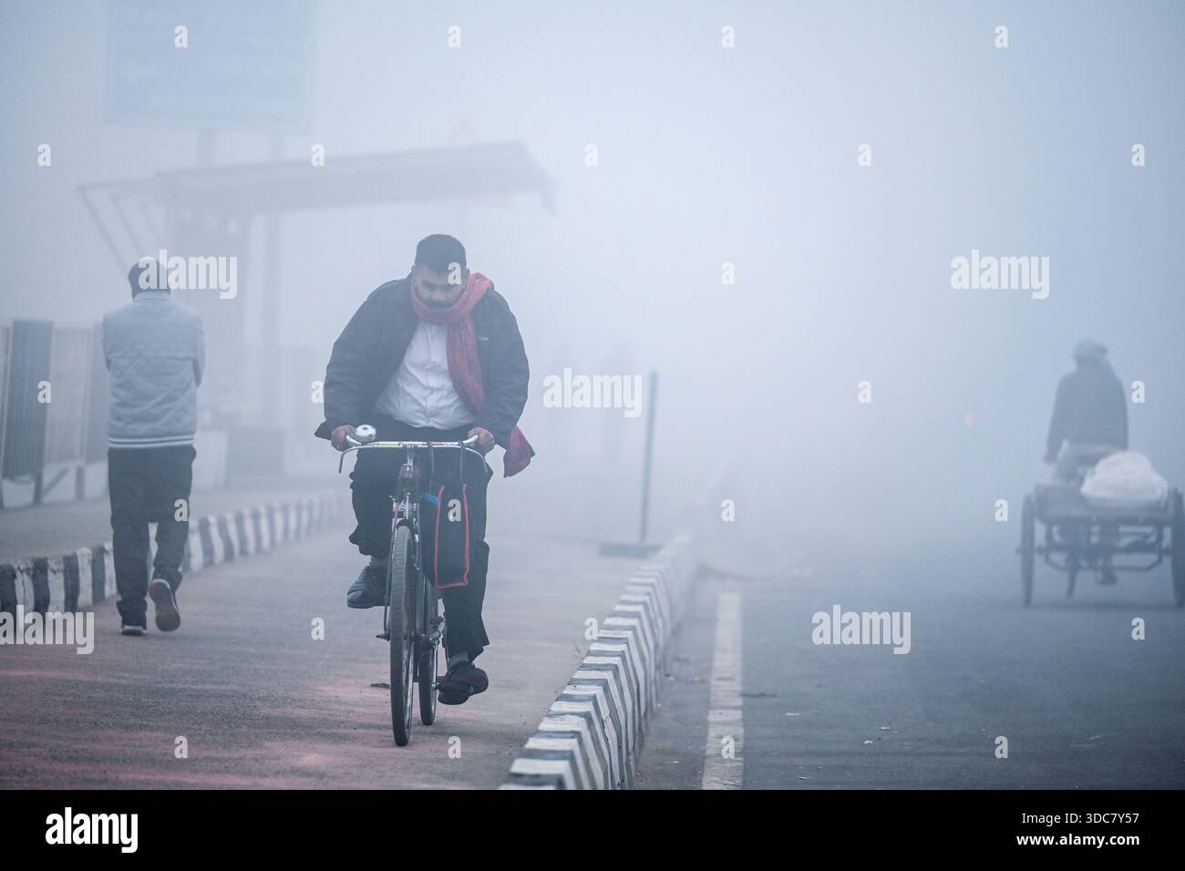 NEW DELHI, INDIA - DECEMBER 20: People seen out on a cold and Foggy ...